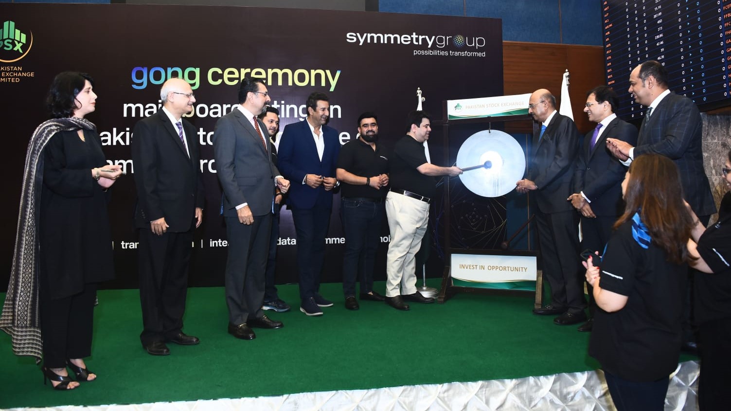 PSX Marks Listing of Symmetry Group with a Gong Ceremony - Biz Today